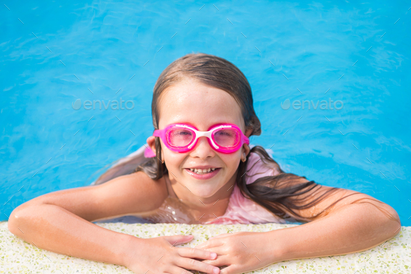 Adorable little girl in outdoor swimming pool Stock Photo by ...