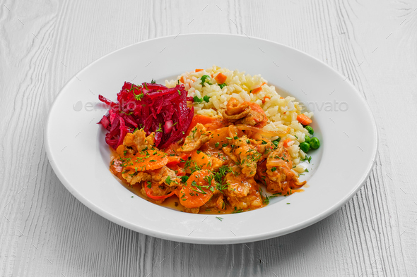 Plate with beef goulash, rice with peas and beetroot salad Stock Photo ...