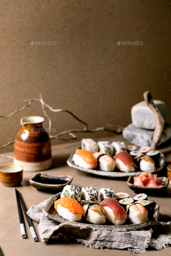 Japanese dish sushi and rolls rice with fish Stock Photo by NatashaBreen