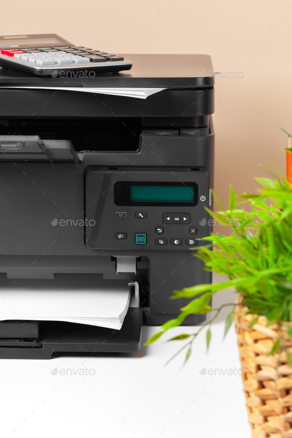 Printer, copier, scanner in office. Workplace Stock Photo by FabrikaPhoto