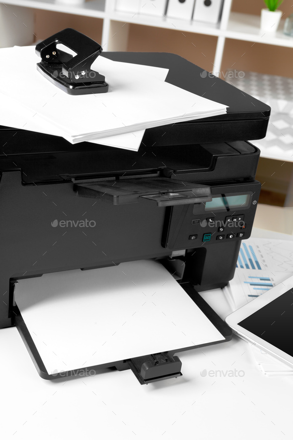 Printer, copier, scanner in office. Workplace Stock Photo by FabrikaPhoto