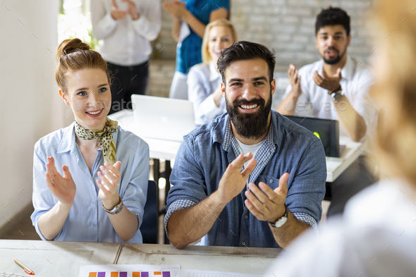 Working on new project together. Group of happy business people ...