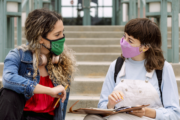 Students studying outdoors at school in the new normal Stock Photo by ...