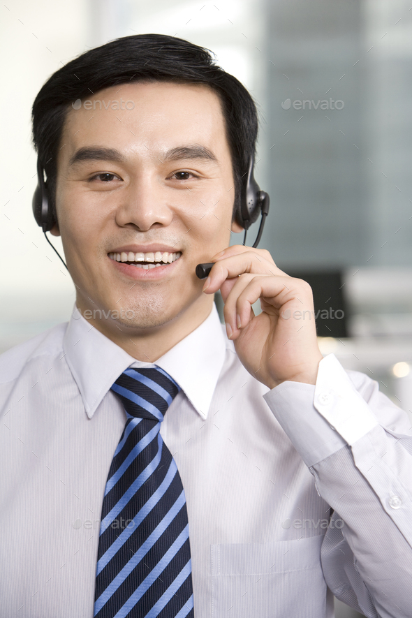 Office worker with a headset Stock Photo by bluejeanimages | PhotoDune