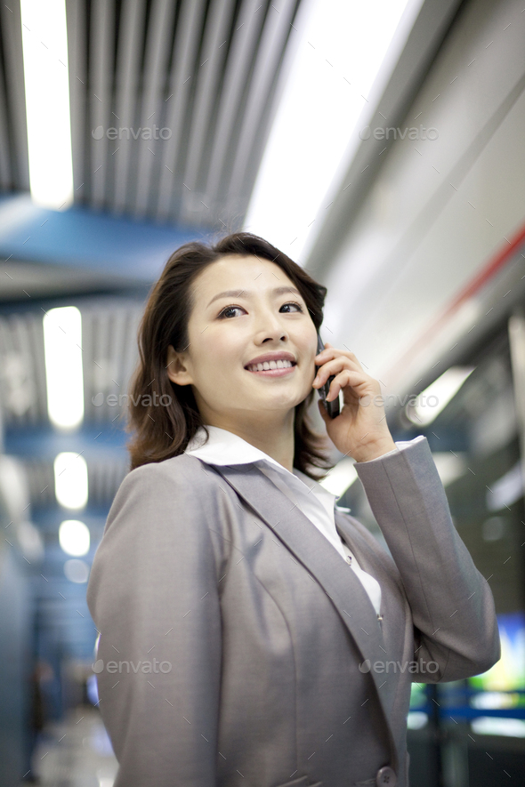 Commuter on the phone Stock Photo by bluejeanimages | PhotoDune
