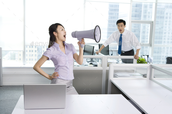 Getting loud in the office Stock Photo by bluejeanimages | PhotoDune