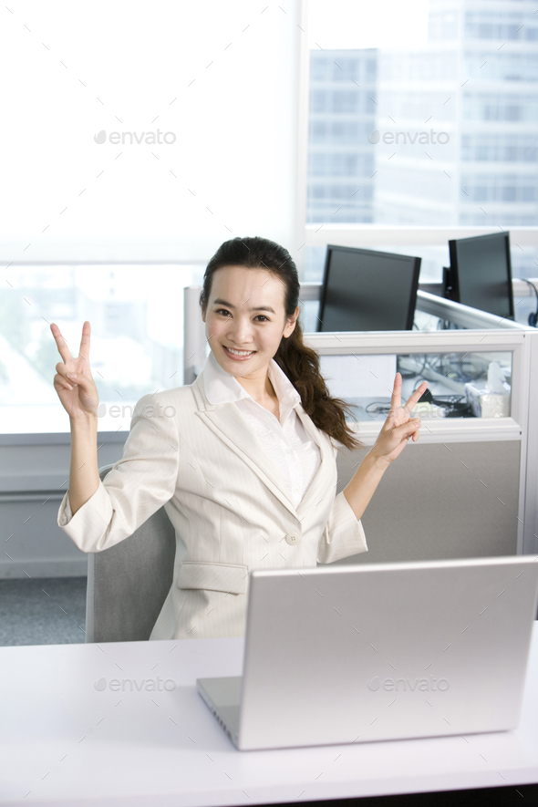 Happy office worker at her desk Stock Photo by bluejeanimages | PhotoDune