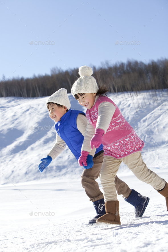 Children having fun in snow Stock Photo by bluejeanimages | PhotoDune