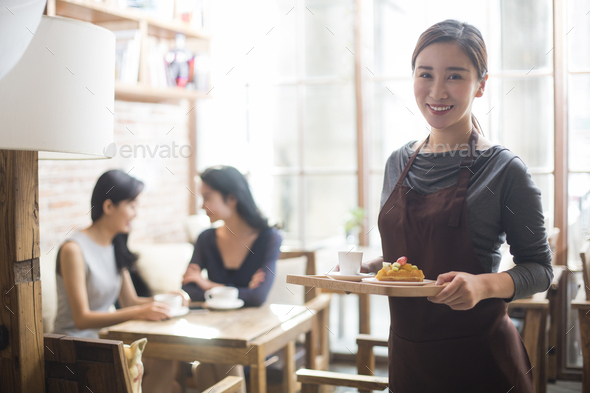 Portrait of coffee shop waitress Stock Photo by bluejeanimages | PhotoDune