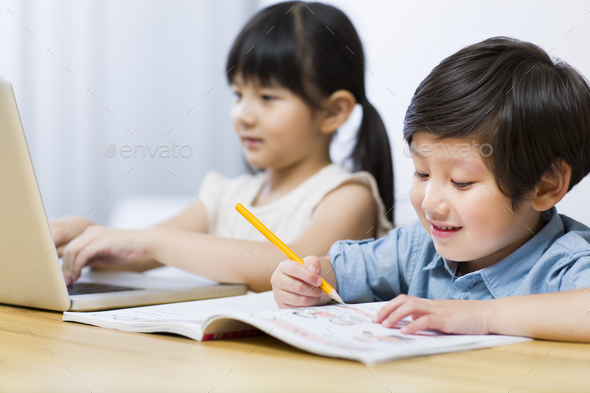 Little boy and girl doing homework Stock Photo by bluejeanimages ...