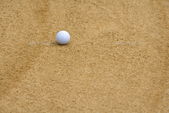 Golf ball in sand bunker Stock Photo by bluejeanimages | PhotoDune