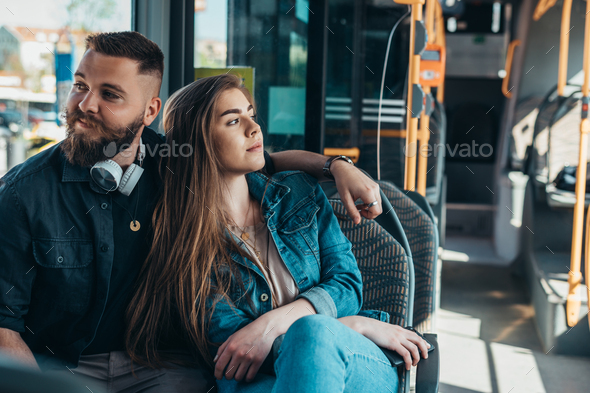 Young beautiful couple in love sitting in a bus and hugging Stock Photo ...