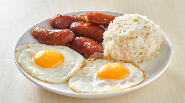 filipino silog breakfast with garlic fried rice, longsilog, and two ...