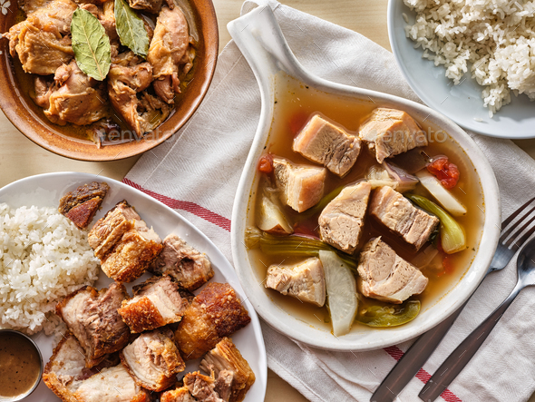 filipino dinner with sinigang, lechon kawali, and chicken adobo top ...