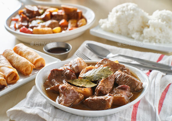 filipino pork adobo in bowl with rice in background Stock Photo by ...
