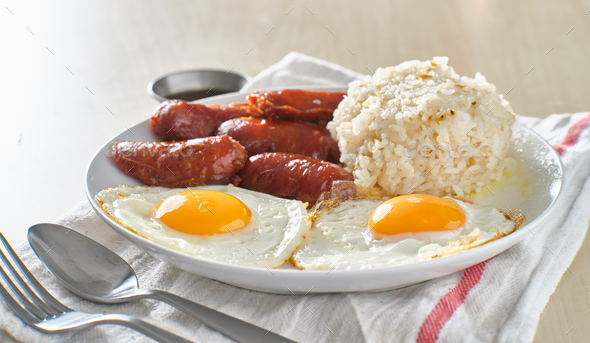 filipino silog breakfast with garlic fried rice, longsilog, and two ...