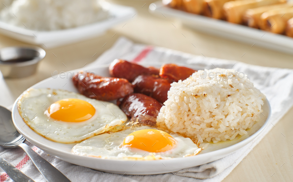 filipino silog breakfast with garlic fried rice, longsilog, and two ...