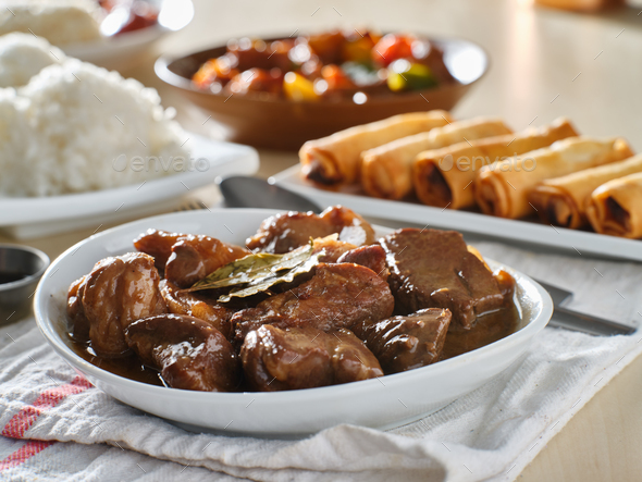 filipino pork adobo in bowl with rice in background Stock Photo by ...