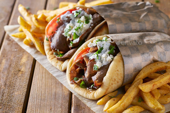 two greek gyros with shaved lamb and french fries Stock Photo by joshua ...
