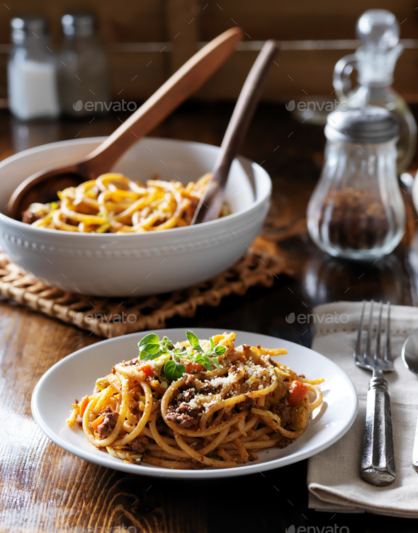 rustic spaghetti and beef dinner with serving bowl in background Stock ...