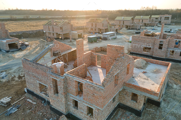 Industrial building site in rural area with residential houses under ...
