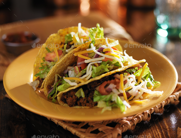 plate of tacos with yellow hard shells and beef Stock Photo by joshua ...