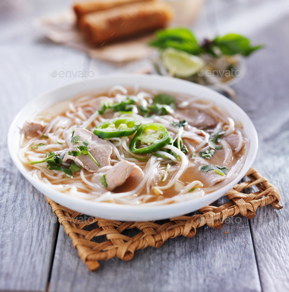 bowl of pho with beef, bean sprouts and peppers Stock Photo by joshua ...