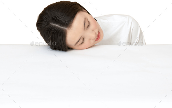 a woman sleeping on a table with her head on the table Stock Photo by ...