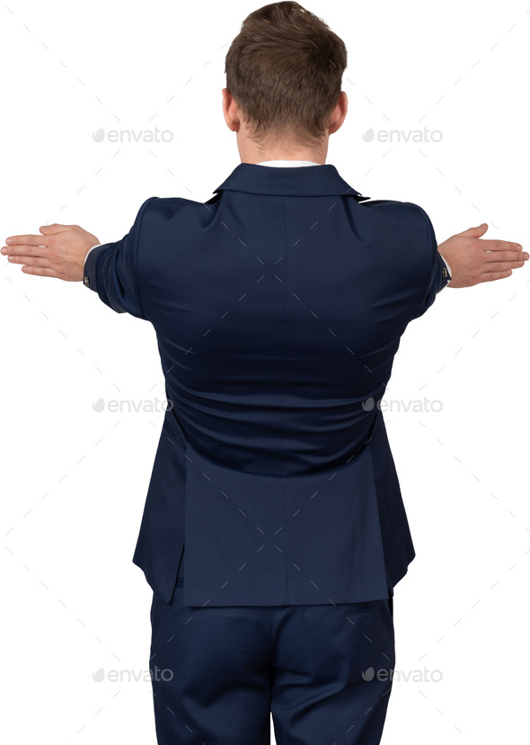 a man in a navy blue suit with his arms outstretched back view Stock ...