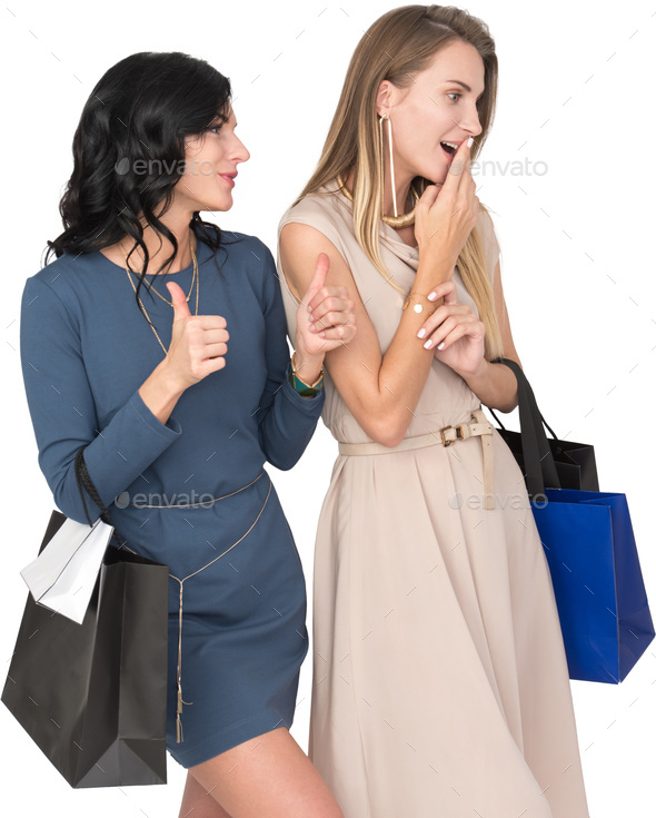 two women holding shopping bags and giving thumbs up to each other ...