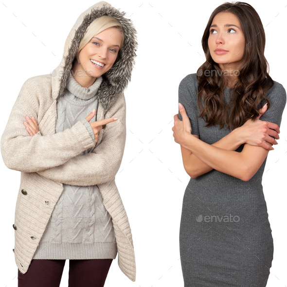 two women standing next to each other with their arms crossed Stock ...