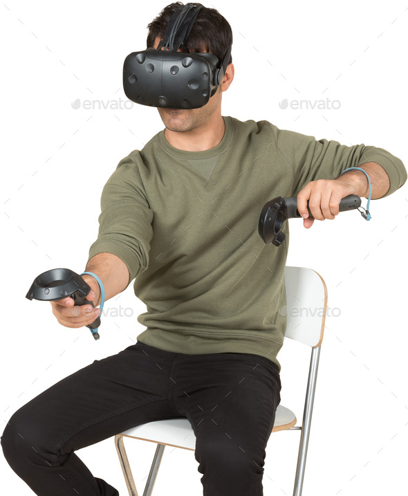 a man sitting on a chair wearing a virtual reality headset and holding ...