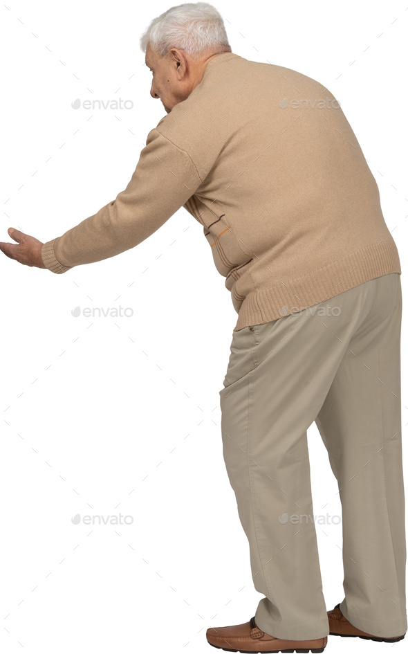 an older man is standing with his arm outstretched and holding his hand ...