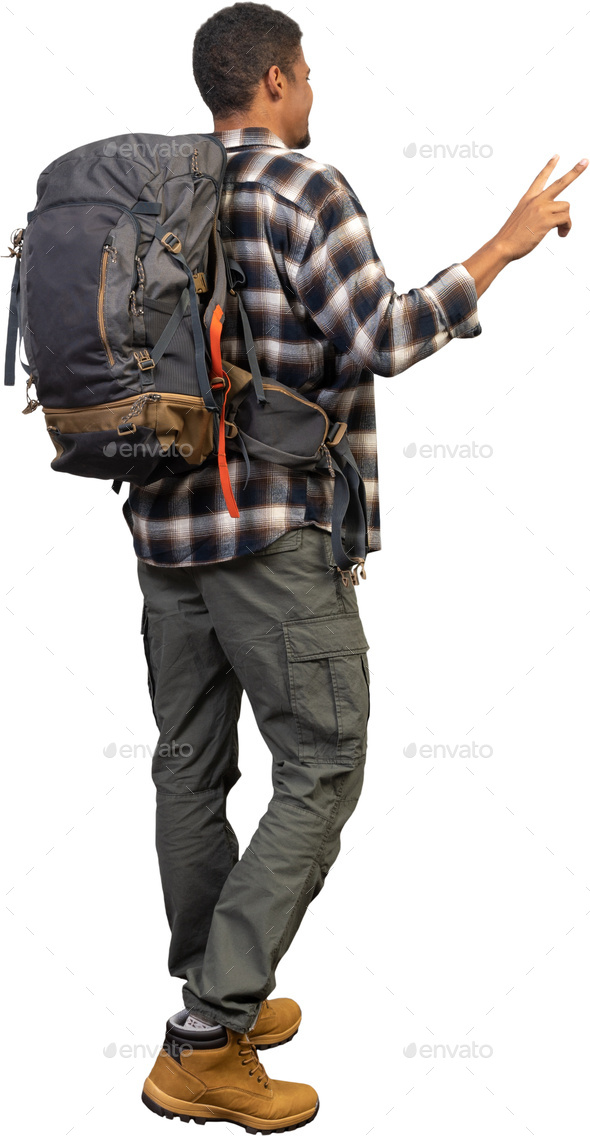 a man with a backpack standing on a floor with his arm outstretched ...
