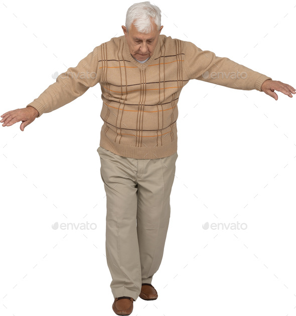 an older man is standing with his arms outstretched and his hands ...