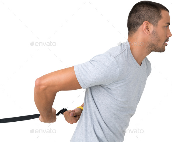 a man tightening his muscles with a resistance rope Stock Photo by Icons8