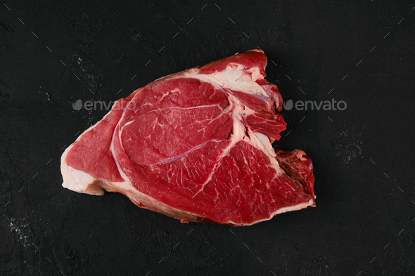 Overhead view of raw top round roast beef on dark background Stock ...