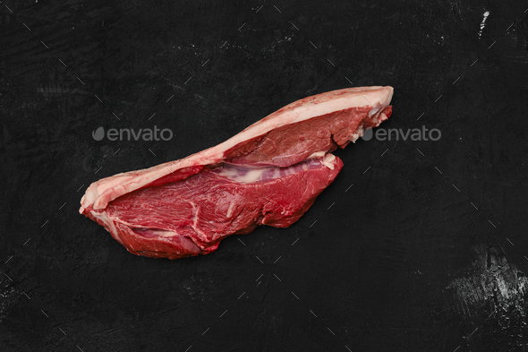 Overhead view of raw beef ribeye lip on with skin Stock Photo by boomeart