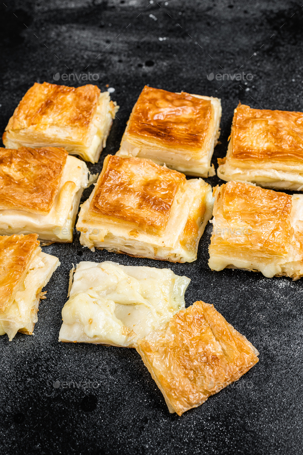 Turkish Su Boregi, Tabla borek or burek with cheese. Black background ...