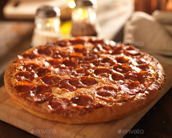Pepperoni pizza at restaurant Stock Photo by joshua_resnick | PhotoDune