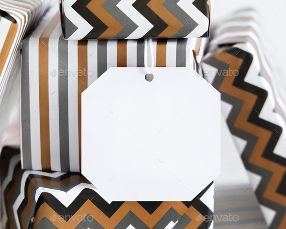 Wrapped present with blank gift tag close up, label Mockup Stock Photo ...