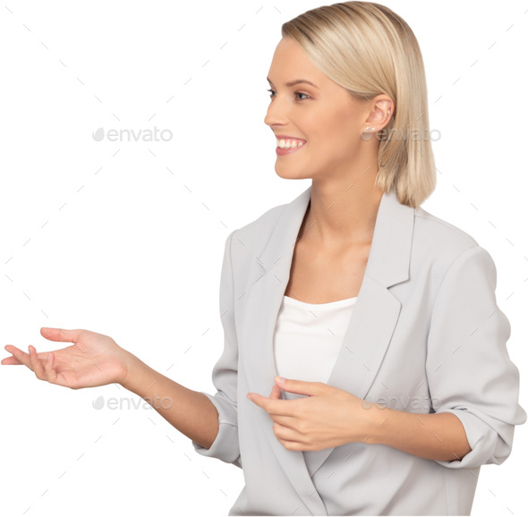 a woman in a white suit holding her hand out and smiling Stock Photo by ...
