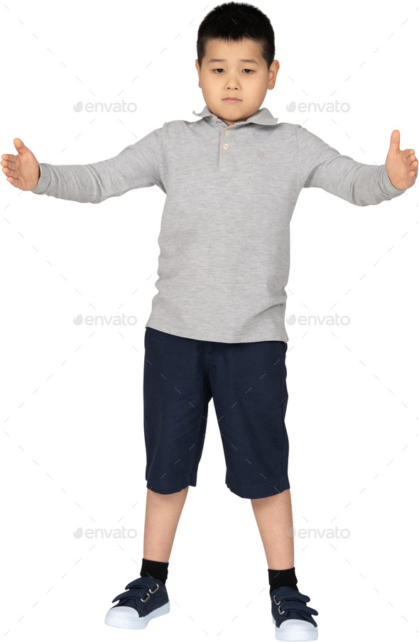 a young boy is standing with his arms outstretched Stock Photo by Icons8
