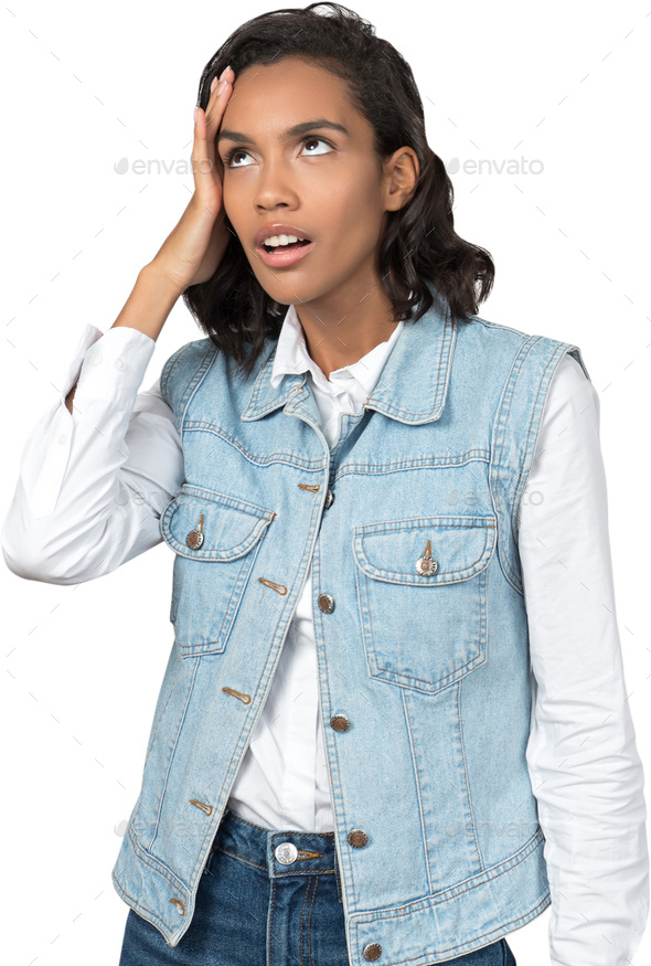 a woman wearing a denim jacket and a white shirt with her hand on her ...