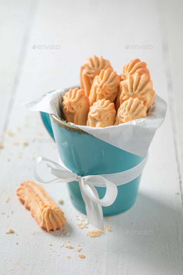 Homemade shortbread cookies in blue coffee cup Stock Photo by Shaiith
