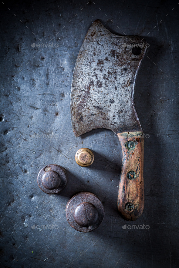 Rustic metal chopper on old metal table. Butcher tools. Stock Photo by ...
