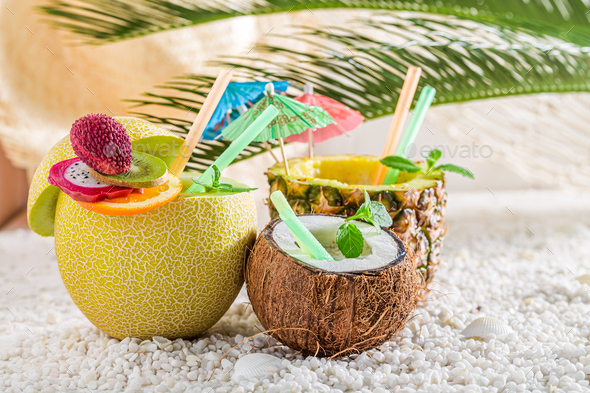 Drinks in tropical fruits. Drink for summer heat. Stock Photo by Shaiith