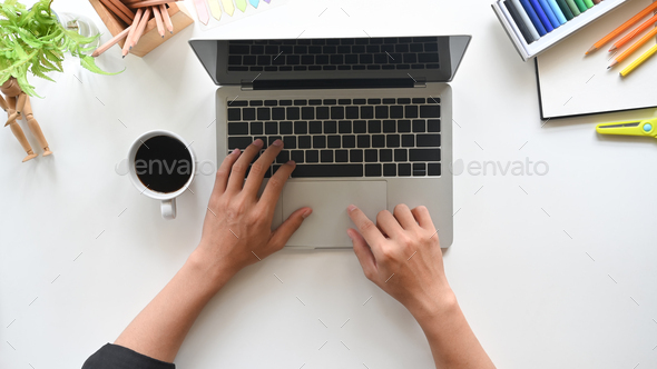 Top view man hands working on modern laptop. Office desktop on white ...