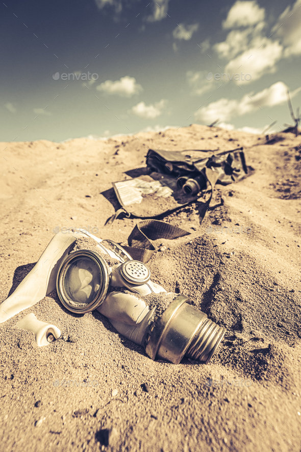 Contaminated gas mask in the toxic and danger desert Stock Photo by Shaiith