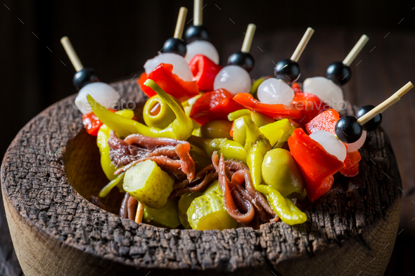 Tasty banderillas made of peppers, anchovies and onion for corrida ...